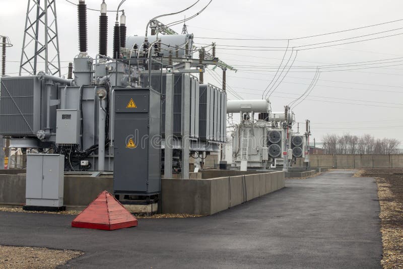 High Voltage Transformers in an Electrical Substation. Side View ...