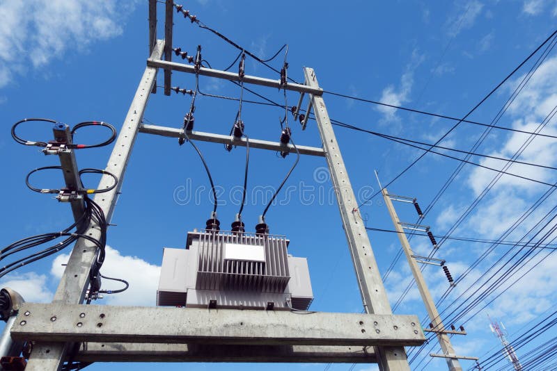 High Voltage Transformers with Power Lines and Blue Sky Background ...