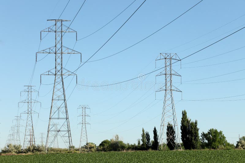 Power Lines Suspended from Electrical Pylons. Stock Photo - Image of ...