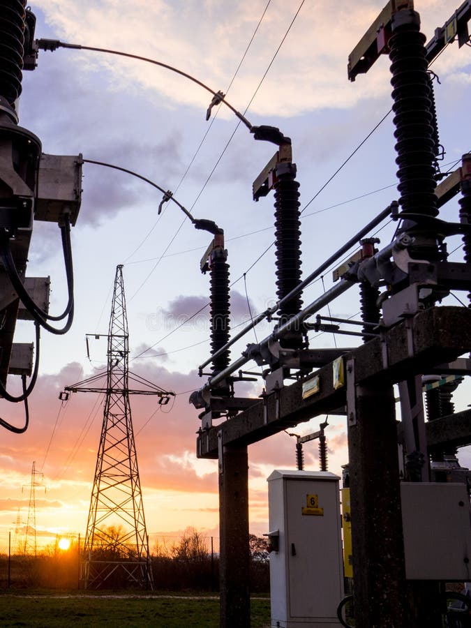 High Voltage Transmission System in the Sunset Sky Stock Photo - Image ...