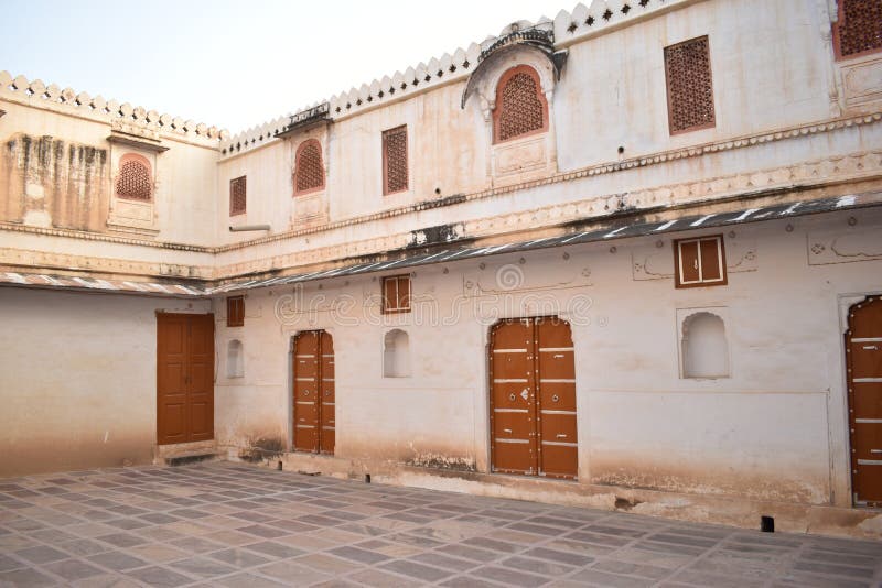 High wall and wooden doors stock image. Image of doors - 171068743