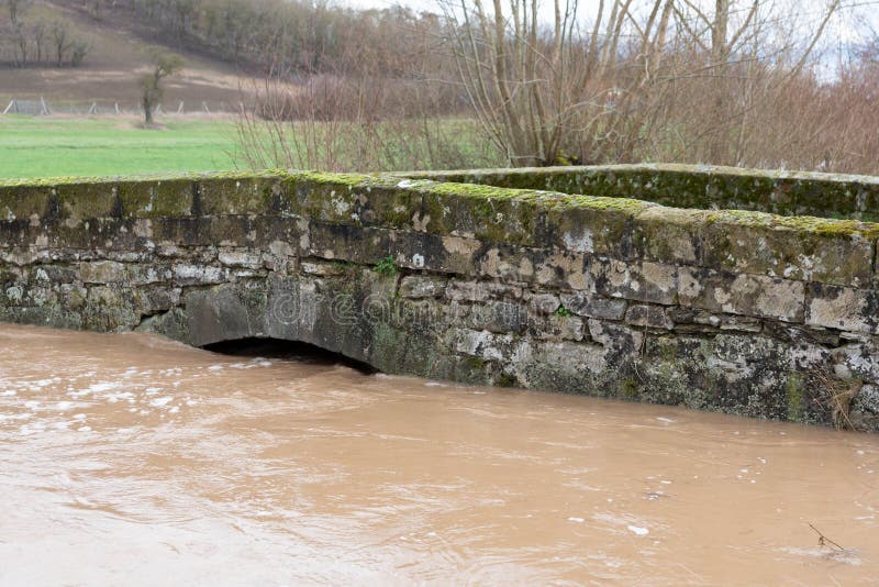 High Water at a Bridge Over a Small River Stock Photo - Image of ...