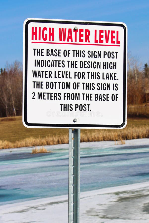 High Water Level Sign Along a Storm Drainage Pond Stock Image - Image ...
