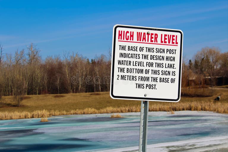 High Water Level Sign Along a Storm Drainage Pond Stock Image - Image ...