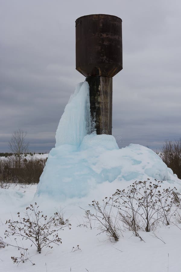 High Water Tower with a Large Block of Blue Ice Stock Image - Image of ...