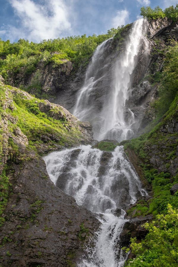 High Waterfall with a Powerful Stream Falling from a Cliff Stock Image ...