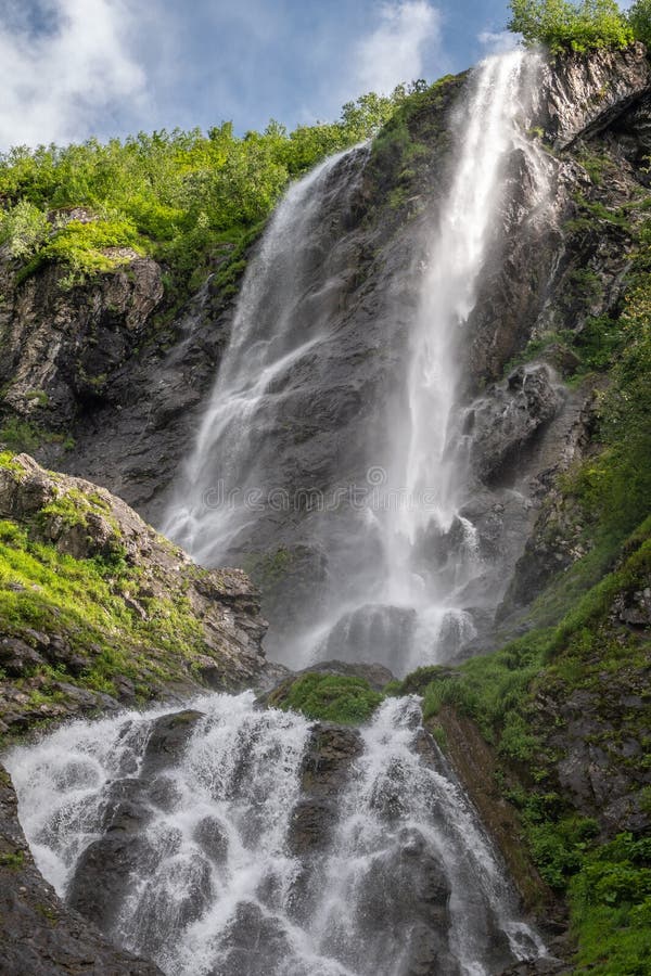 High Waterfall with a Powerful Stream Falling from a Cliff Stock Image ...