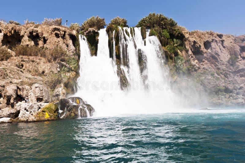 High Waterfall Flowing into the Sea Stock Photo - Image of beach, lake ...