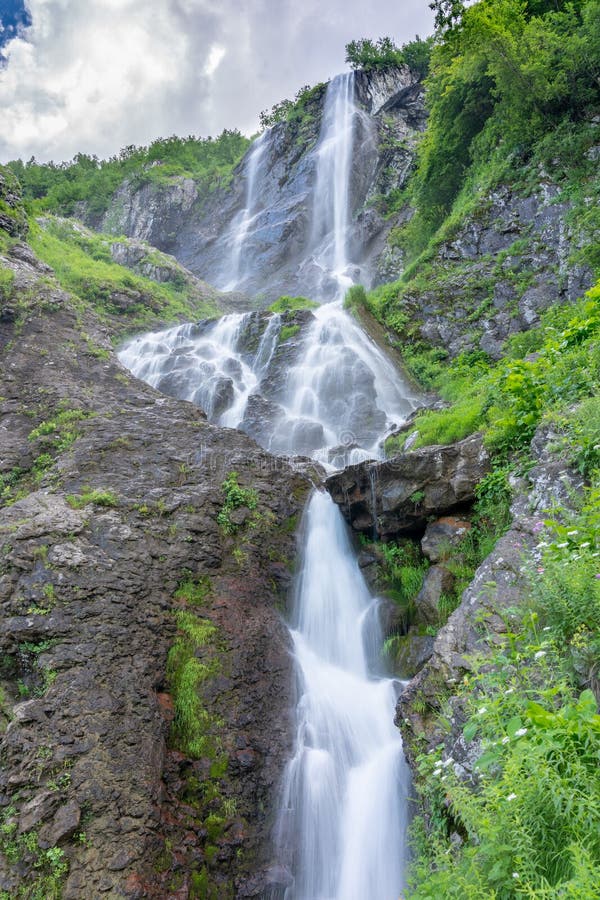 High Waterfall with a Powerful Stream Falling from a Cliff Stock Image ...