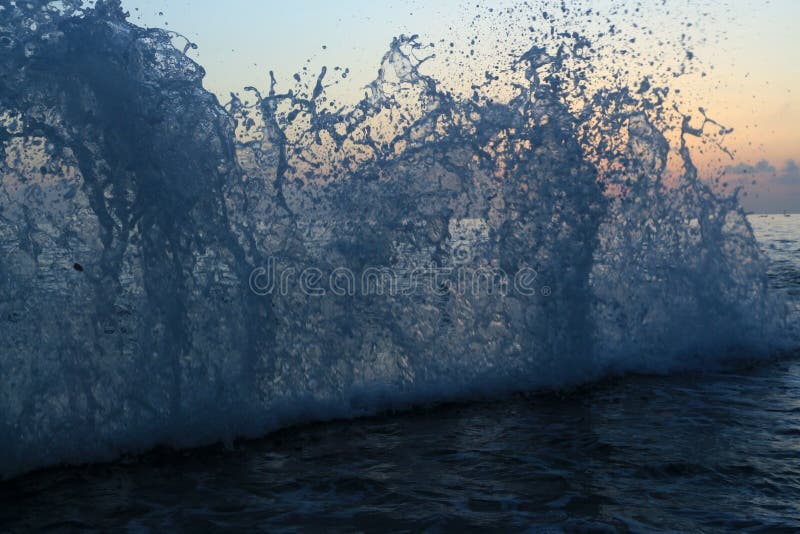 High Wave with Splashes in the Sea with Sunset. Stock Image - Image of ...
