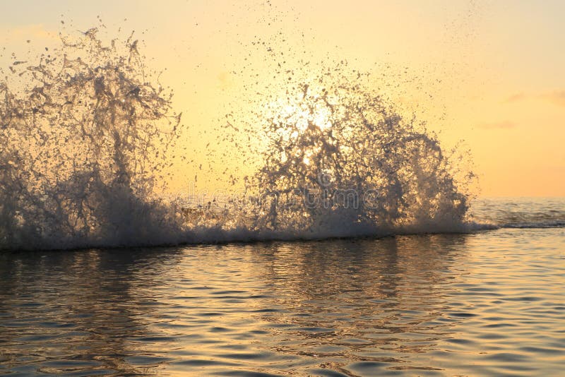 High Wave with Splashes in the Sea with Sunset. Stock Image - Image of ...