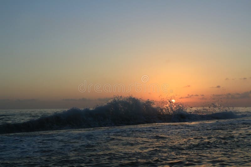 High Wave with Splashes in the Sea with Sunset. Stock Image - Image of ...