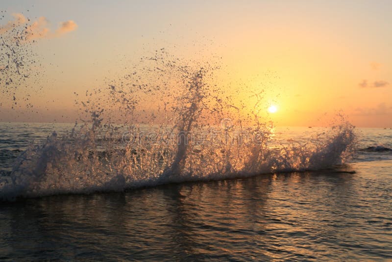 High Wave with Splashes in the Sea with Sunset. Stock Image - Image of ...