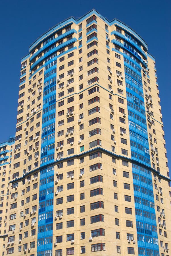 High Yellow Building on Blue Cloudless Sky Stock Image - Image of ...