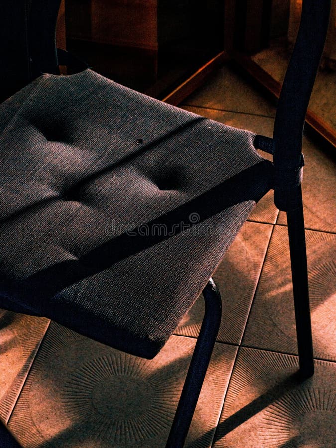 Highangle Shot of an Old Metal Chair Gleaming Under the Sun S Shadow ...