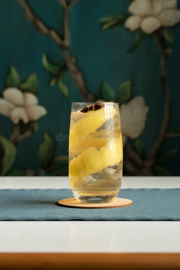 Highball Cocktail with Lemon Peel, Anise and Ice on the Table at ...