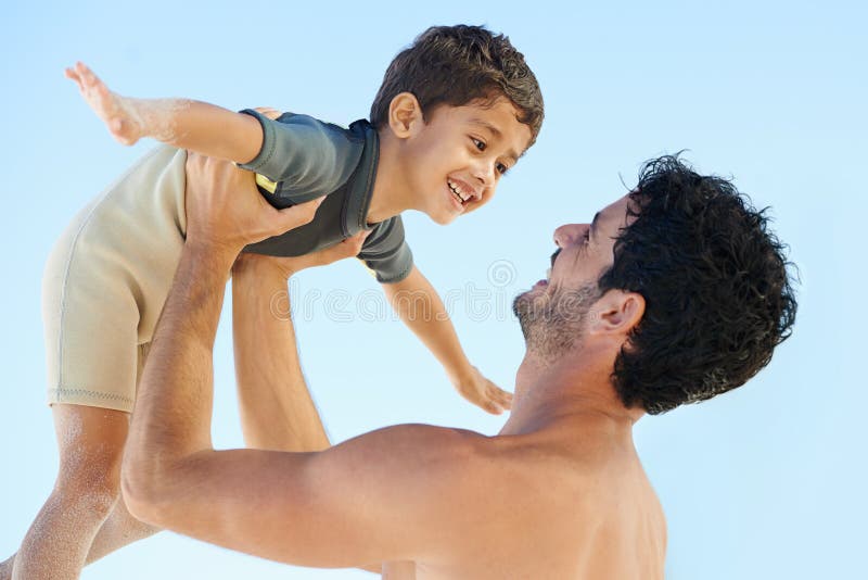 Higher Dad. a Father Raising His Son Up in the Air. Stock Photo - Image ...