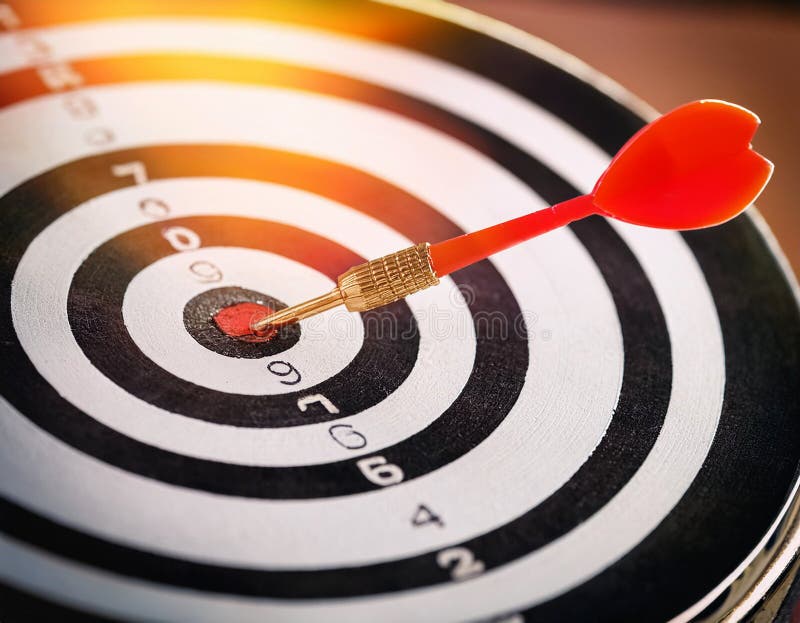 Highlight a Dart Hitting a Bullseye on a White Dartboard, Symbolizing ...