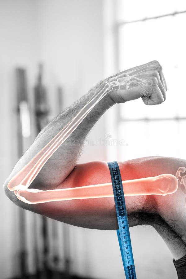 Highlighted Arm of Man Measuring Biceps with Measuring Tape Stock Image ...