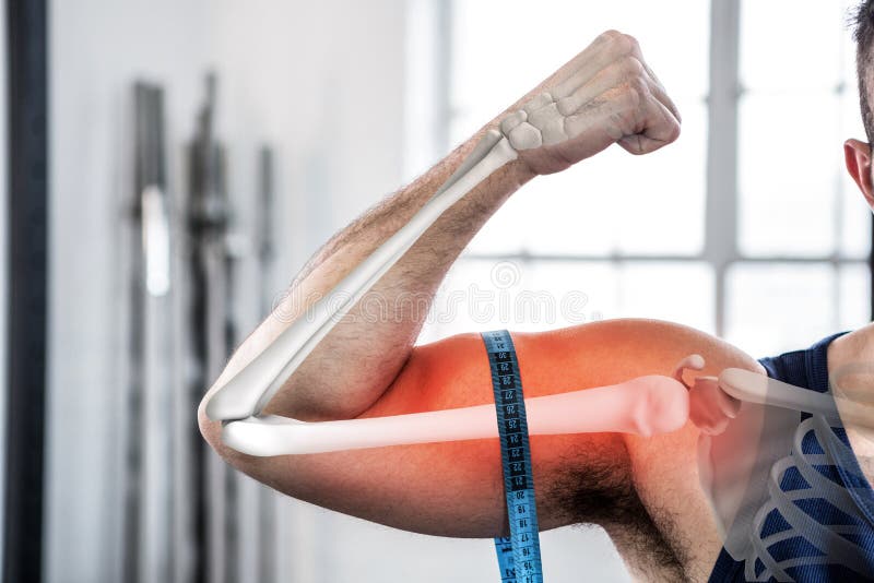 Highlighted Arm of Man Measuring Biceps with Measuring Tape Stock Photo ...