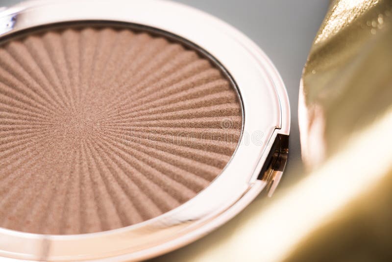 Highlighter for Makeup on a Grey Background with Gold Elements ...