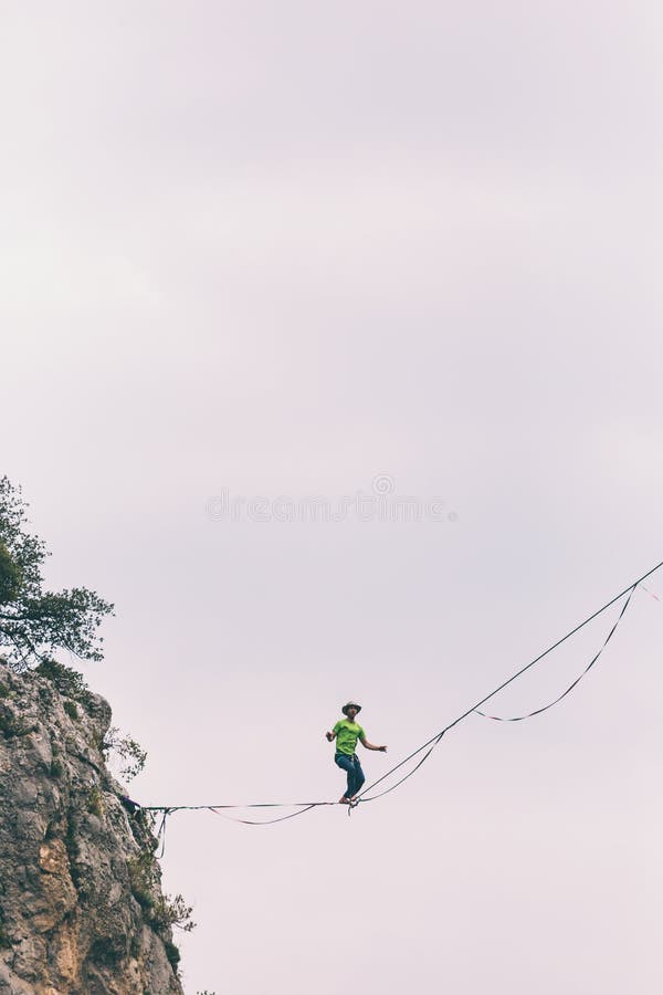 Highliner Balances Over the Abyss Stock Photo - Image of cloud, danger ...