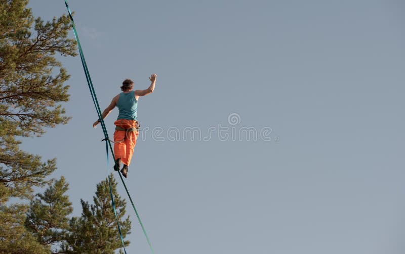 Highliner Walks on a Tightrope Against the Backdrop of the Sky Stock ...