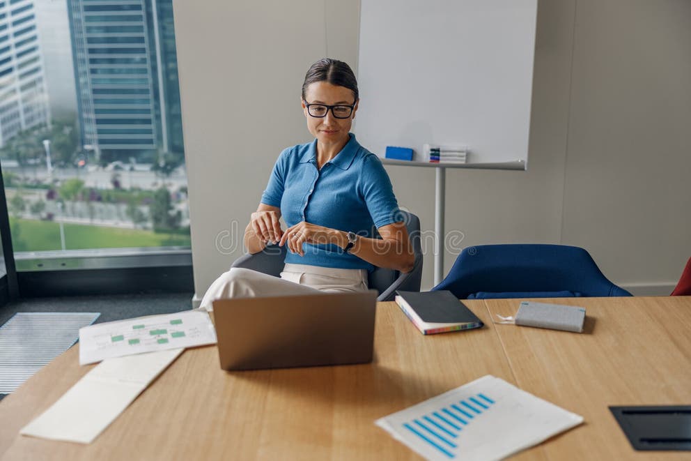 A Professional Woman Successfully Working in a Modern Office ...