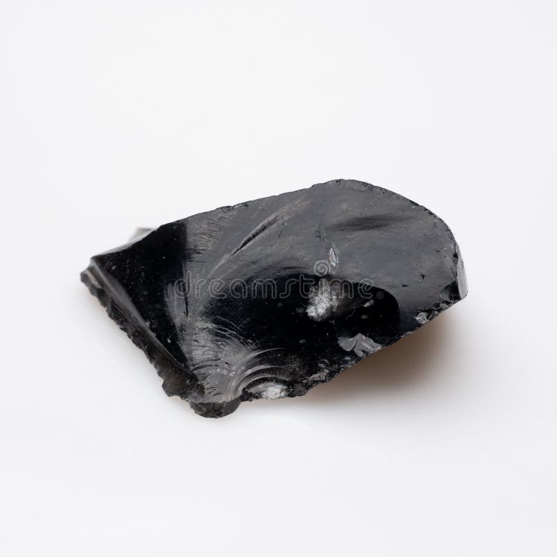 A Highly Polished Black Obsidian Fragment Displaying a Sharp, Glass ...
