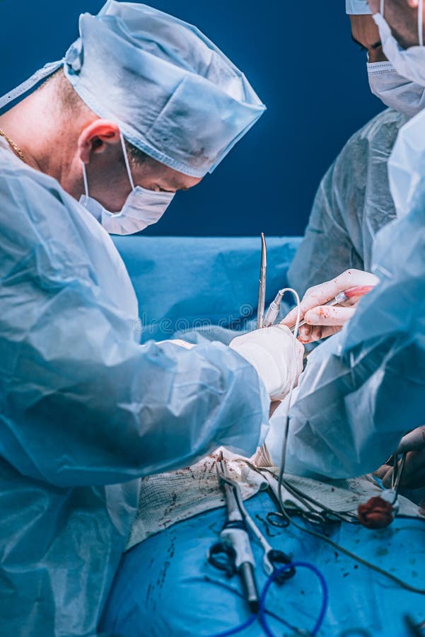 A Highly Qualified Team of Surgeons Performs a Complex Operation To ...