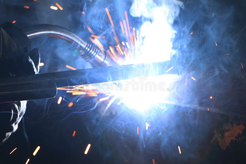 A Highly Skilled Welder Welds a Metal Structure at an Assembly Plant ...