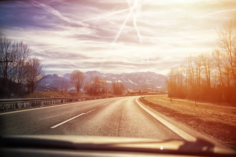 Highway in the Alps. View from Inside Car, Sunset or Sunrise Stock ...