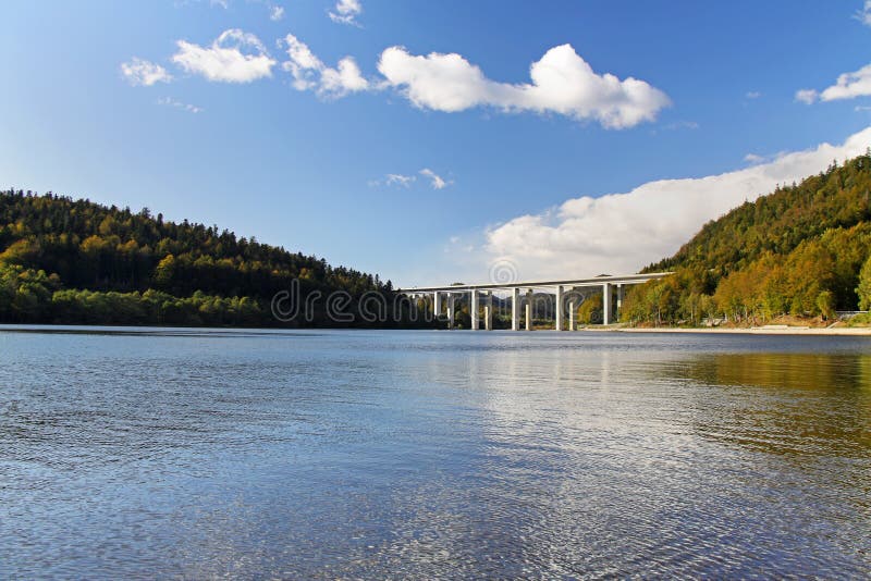 Highway bridge over a lake stock photo. Image of reflection - 64534548