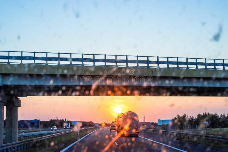 Highway and Bridge at Sunset through a Dirty Windshield, Emphasizing ...