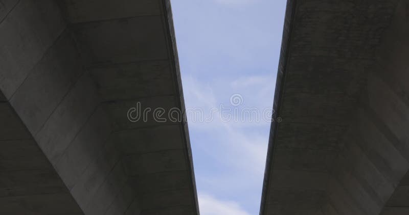 Highway Bridge Underpass Structure with Concrete Columns on a Blue Sky ...