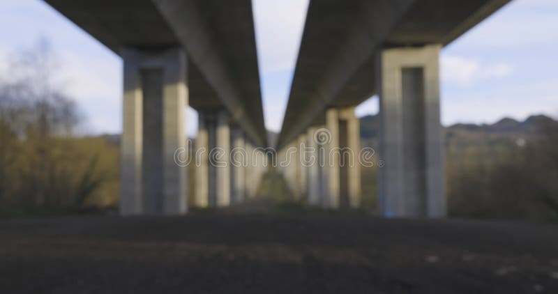 Highway Bridge Underpass Structure with Concrete Columns on a Blue Sky ...