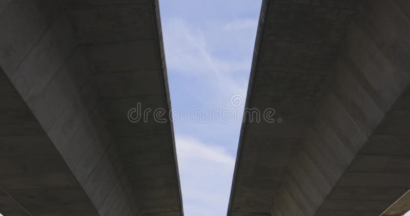 Highway Bridge Underpass Structure with Concrete Columns on a Blue Sky ...