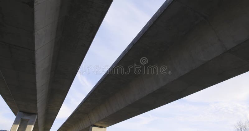 Highway Bridge Underpass Structure with Concrete Columns on a Blue Sky ...