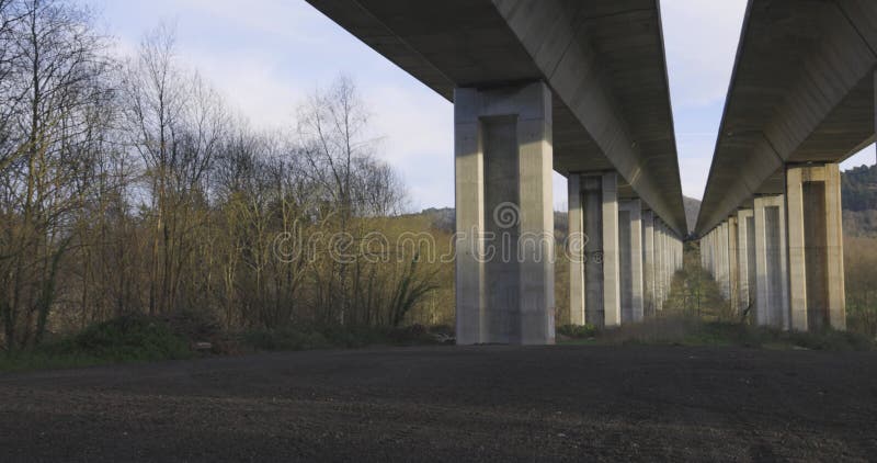 Highway Bridge Underpass Structure with Concrete Columns on a Blue Sky ...