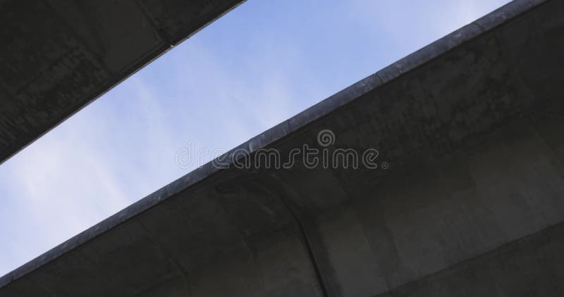 Highway Bridge Underpass Structure with Concrete Columns on a Blue Sky ...