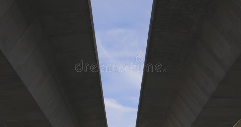 Highway Bridge Underpass Structure with Concrete Columns on a Blue Sky ...