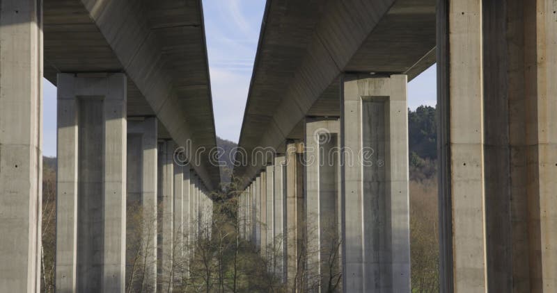 Highway Bridge Underpass Structure with Concrete Columns on a Blue Sky ...