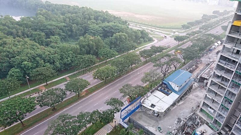 A Highway and a Building Construction Stock Photo - Image of trees ...