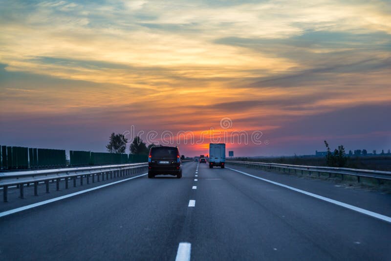 Highway driving at sunset editorial stock image. Image of constanta ...