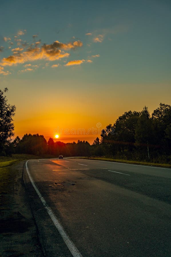 Highway through the Forest in the Early Morning at Dawn with the Car ...