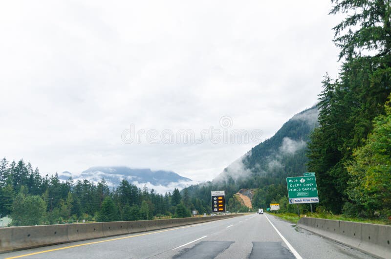 Highway in Hope BC, Canada with Cloud Covered Mountains in the ...