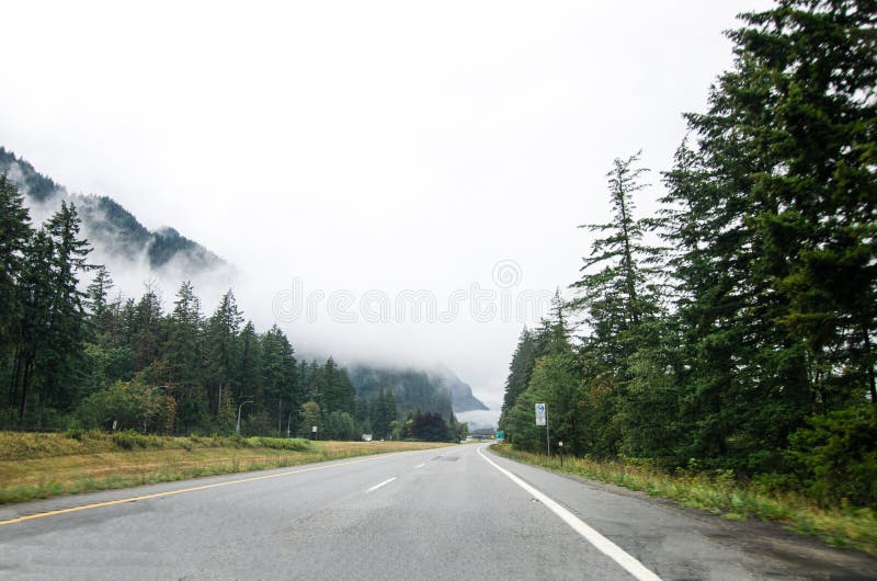 Highway in Hope BC, Canada with Cloud Covered Mountains in the ...