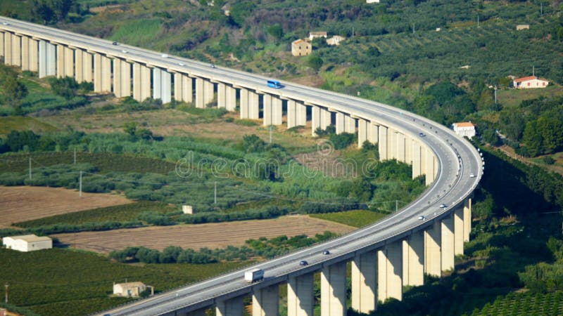 Highway Curve and Roadside Structures Stock Footage - Video of event ...