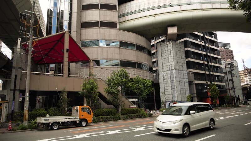 A Highway Passing through the TKP Gate Tower Building in Osaka, Japan ...