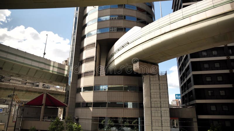 A Highway Passing through the TKP Gate Tower Building in Osaka, Japan ...